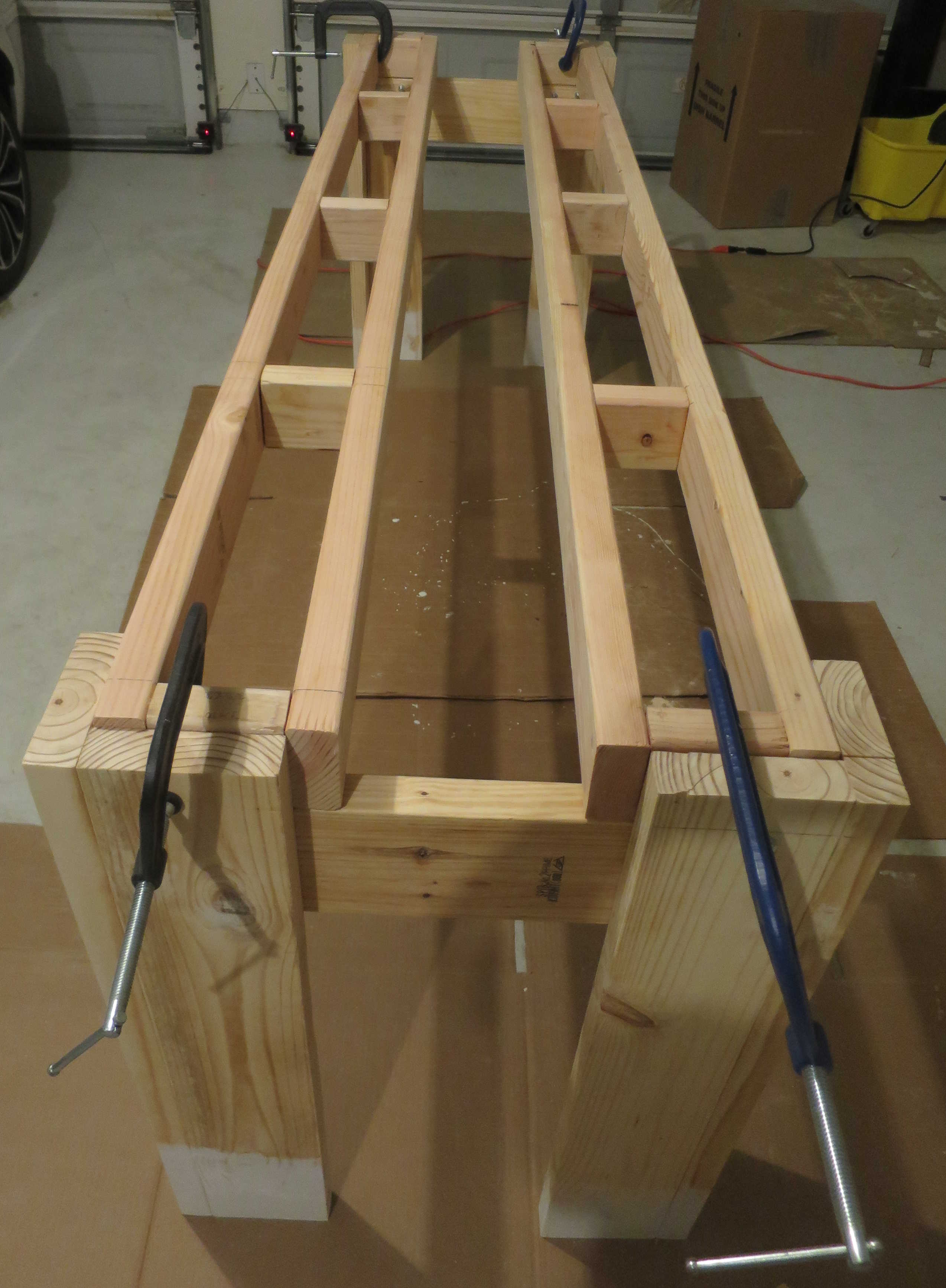 Both Table Legs Clamped to main beams Side